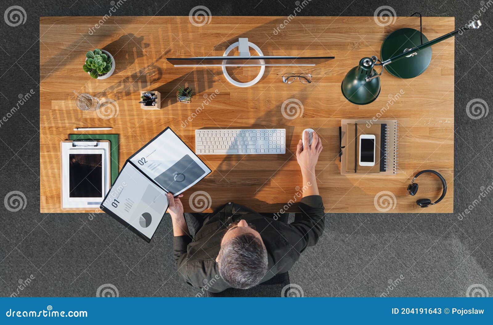 Top View of Businessman Working on Computer at Desk with Paperwork in ...