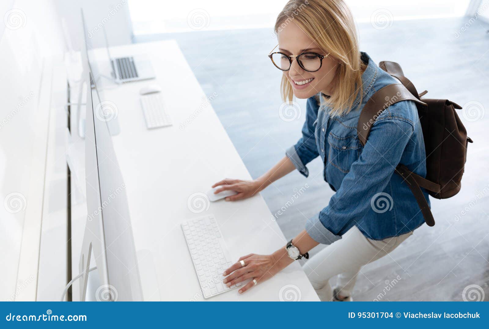 Top View of Cheerful Female Shopper Using Computer at Store Stock Photo ...