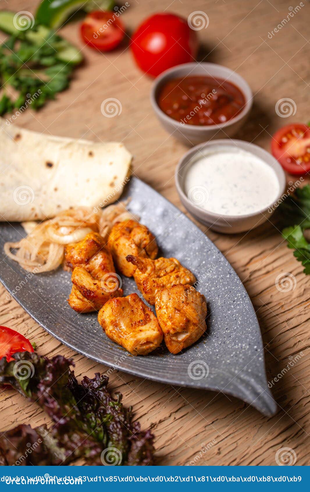 Top View of a Chicken Kebab with Sauce in a Plate on a Table in a ...