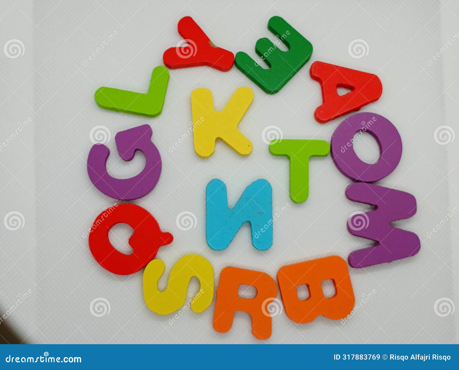 Top View of Child Arm Learning Alphabet on White Backround Stock Image ...