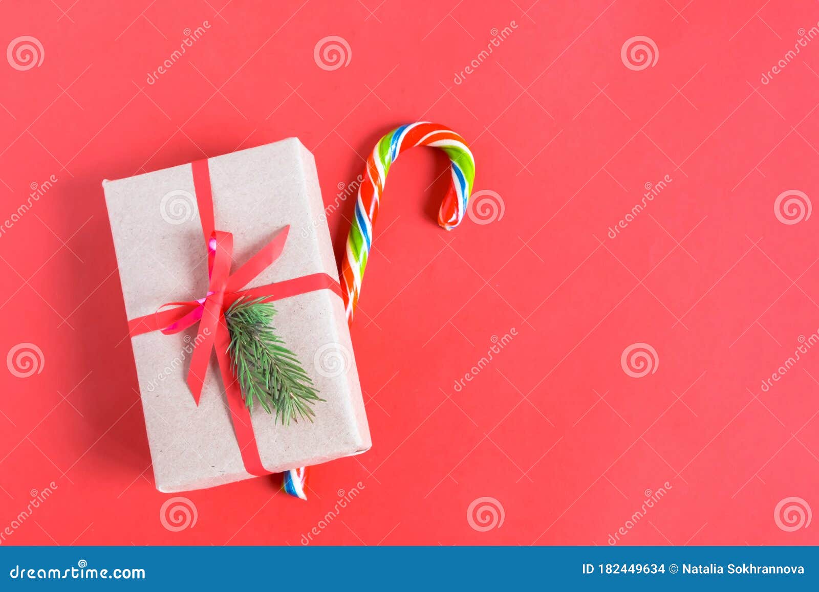 Top View Christmas Gift and Christmas Staff Candy on a Red Background ...