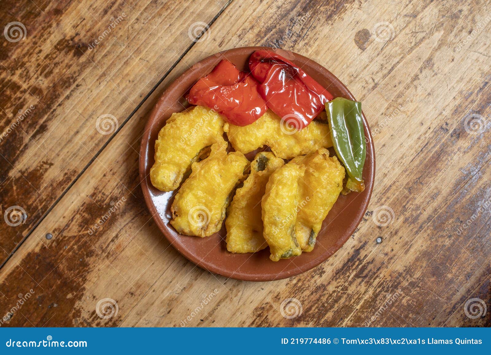 Top View of Clay Plate with Battered Cod Portion and Fried Peppers As ...