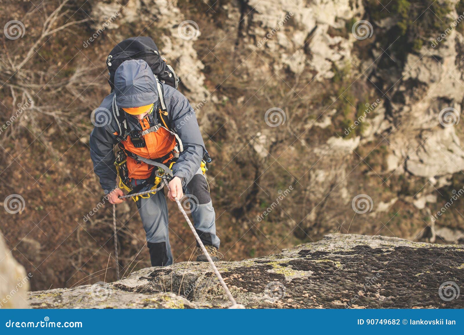 Top View, Climber on Rope and Helmet Rises on Vertical Rock Stock Photo ...