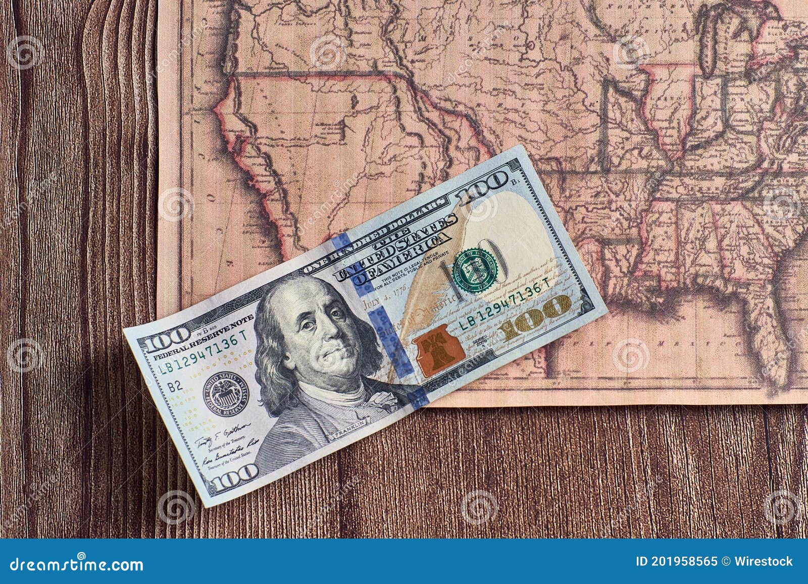 Top View Closeup of 100$ Banknote Placed on an Ancient Map on a Wooden ...