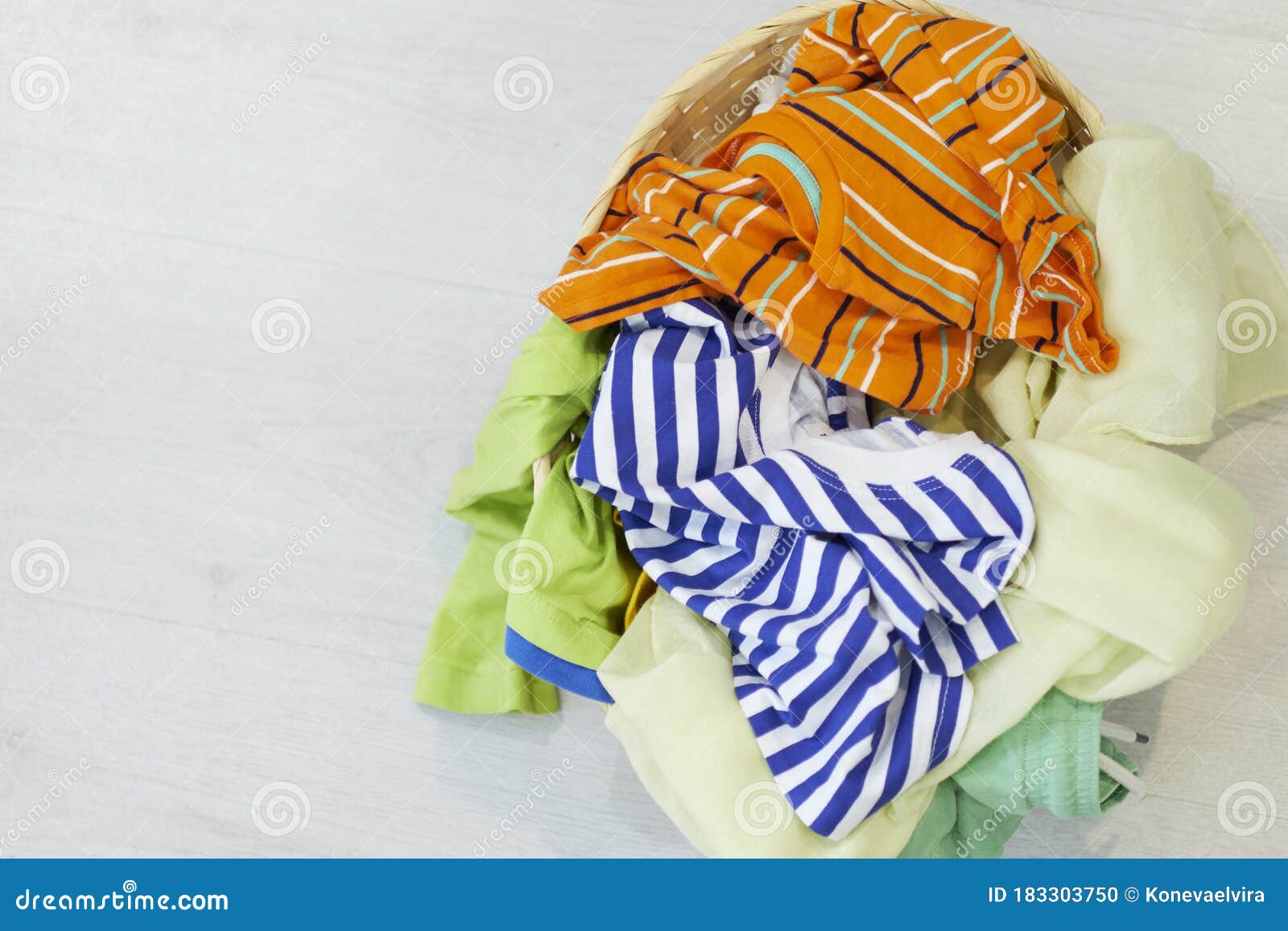 Top View Clothes in a Laundry Basket on Wood Floor. Stock Photo - Image ...