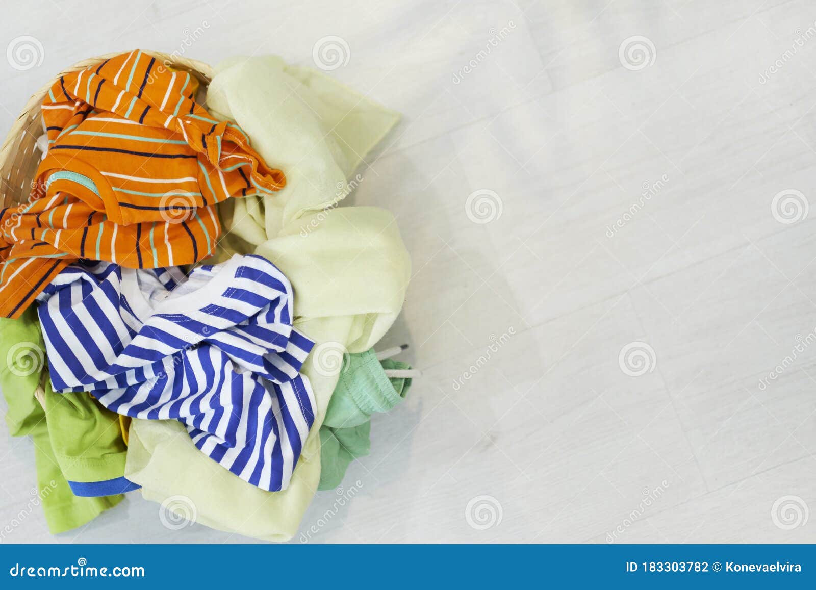 Top View Clothes in a Laundry Basket on Wood Floor. Stock Photo - Image ...