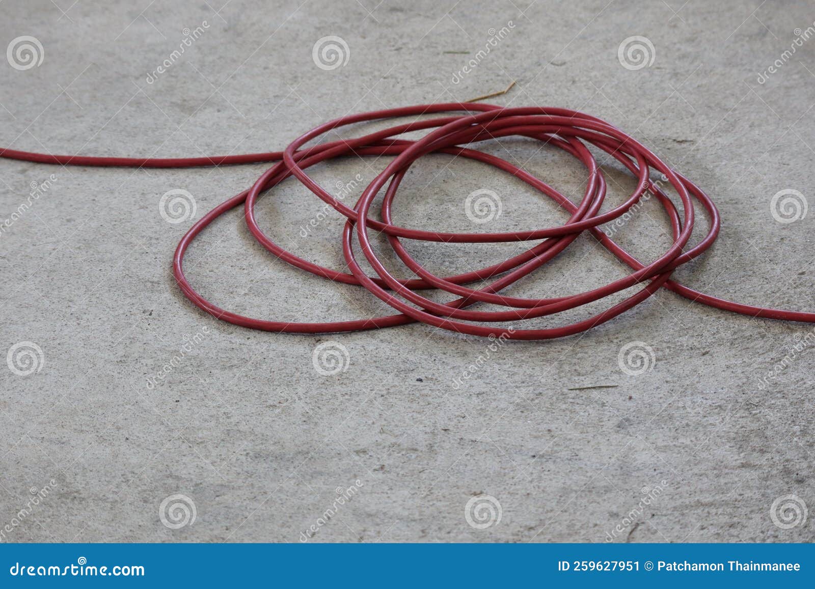 Top View, Coiled Red Wire or Cable Laid on Selectable Focus Cement ...