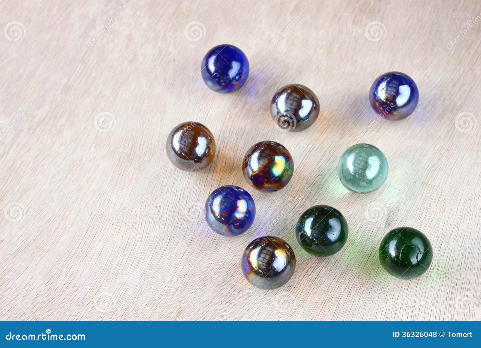 Top View of Collection of Shiny Marbles on Wooden Background Stock ...
