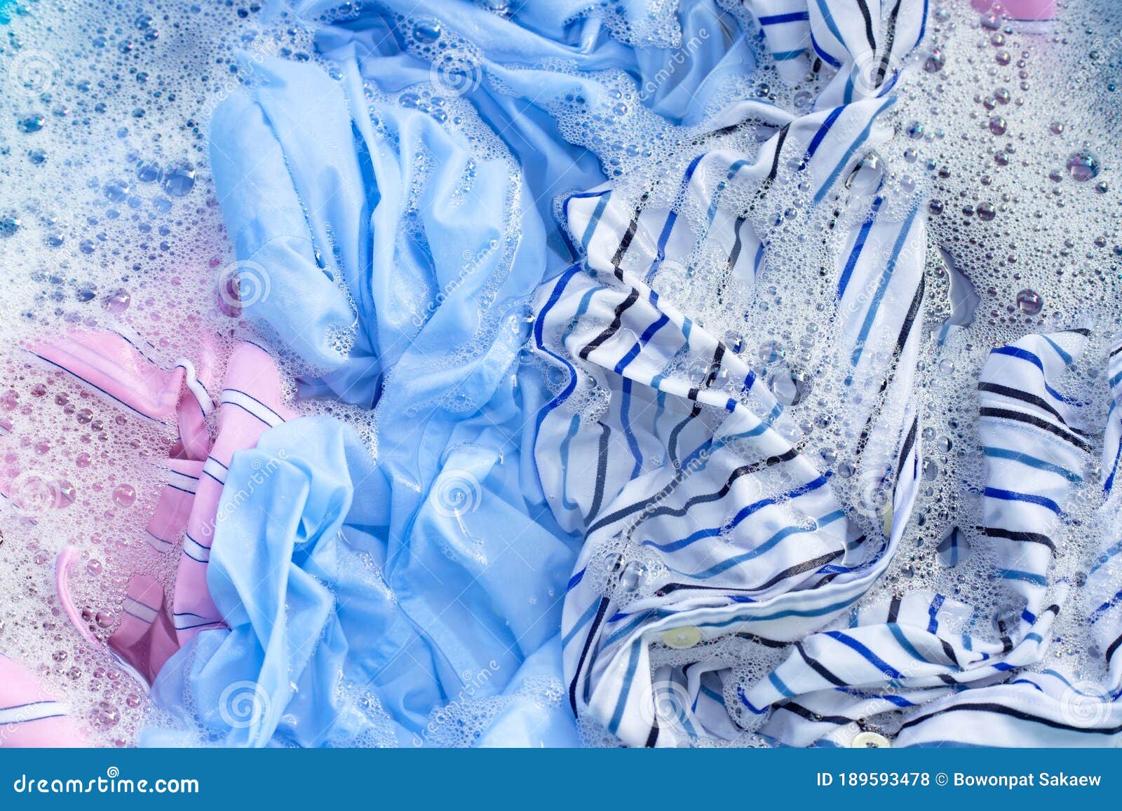 Color Clothes Soak in Powder Detergent Water Dissolution. Laundry ...