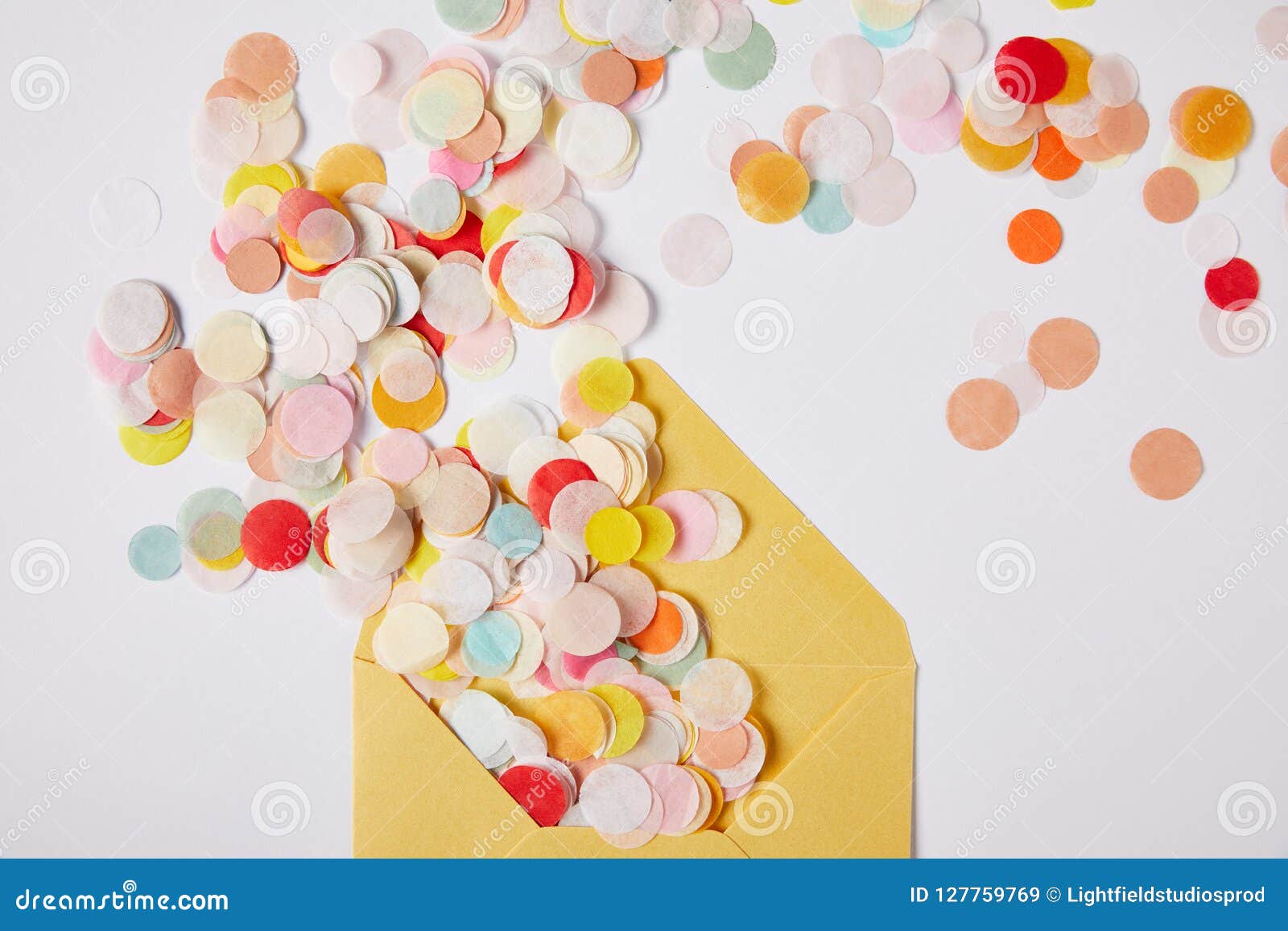 Top View of Colored Confetti Pieces and Yellow Envelope on White ...