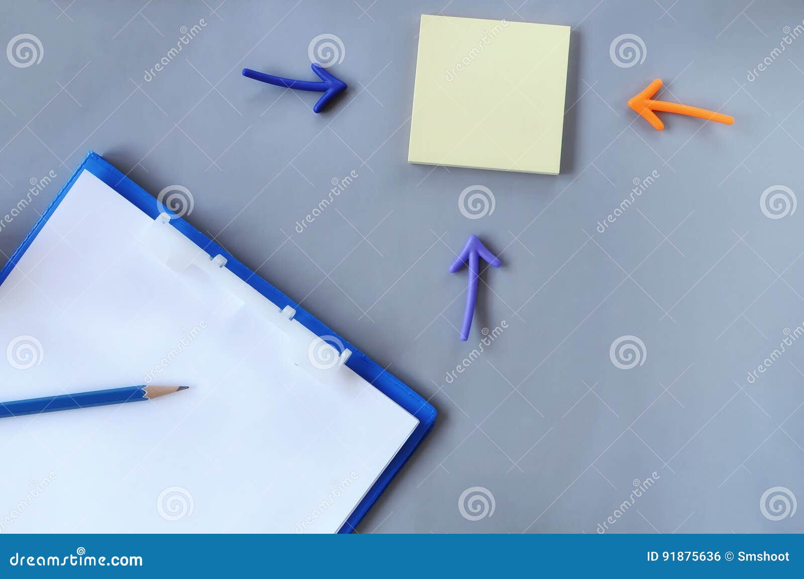 Top View of Colorful Arrow, Sticky Note, Pad and Pencil Stock Photo ...
