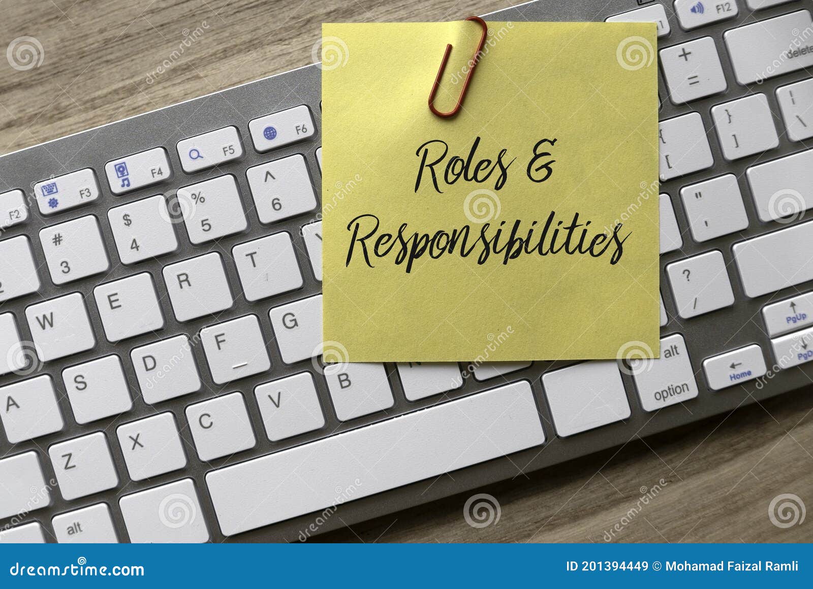 Roles And Responsibilities. Paper People Holding Hands On Wooden Table ... Roles And Responsibilities. Paper People Holding Hands On Wooden Table ...