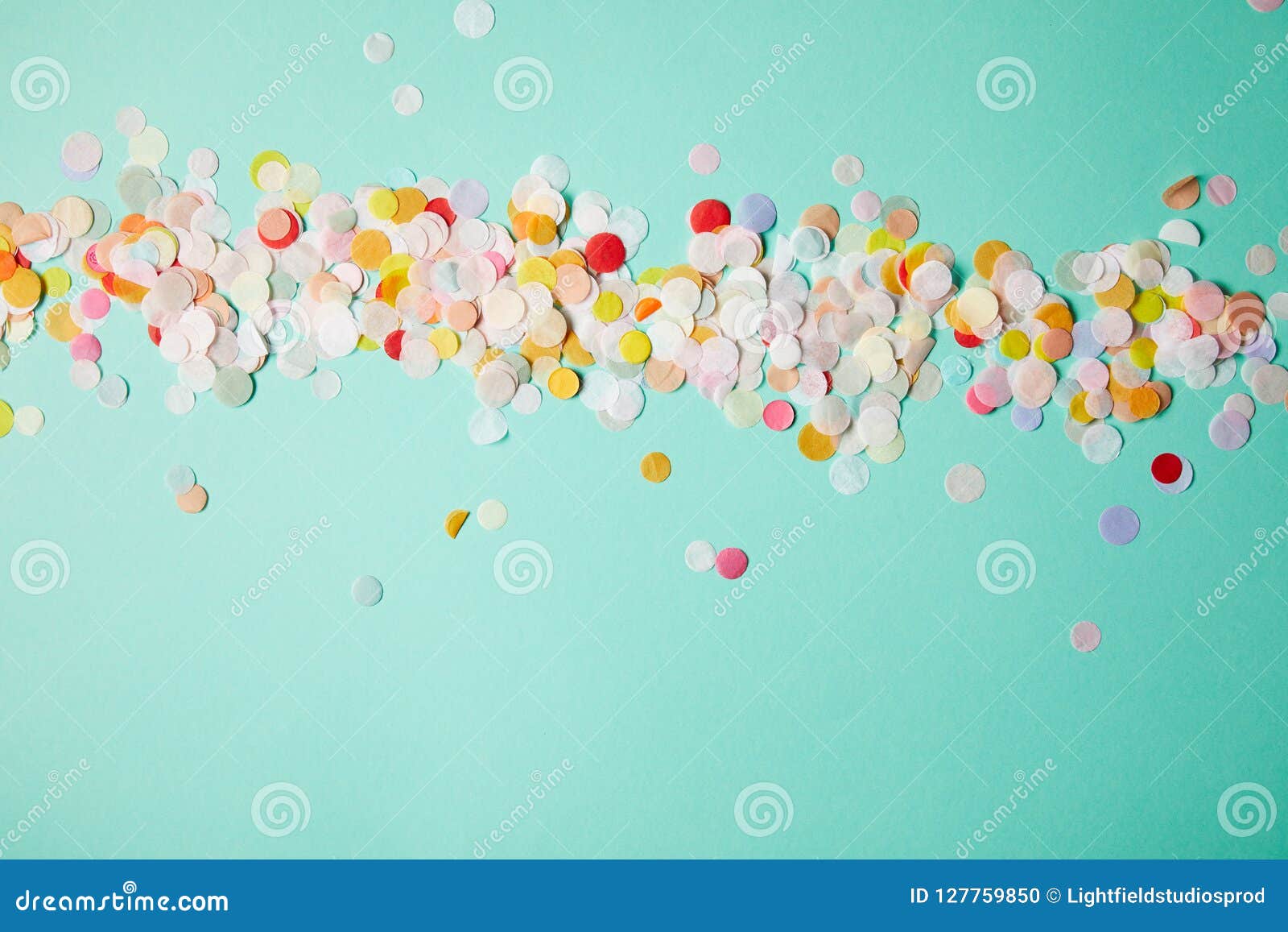 Top View of Confetti Pieces on Turquoise Surface Stock Photo - Image of ...