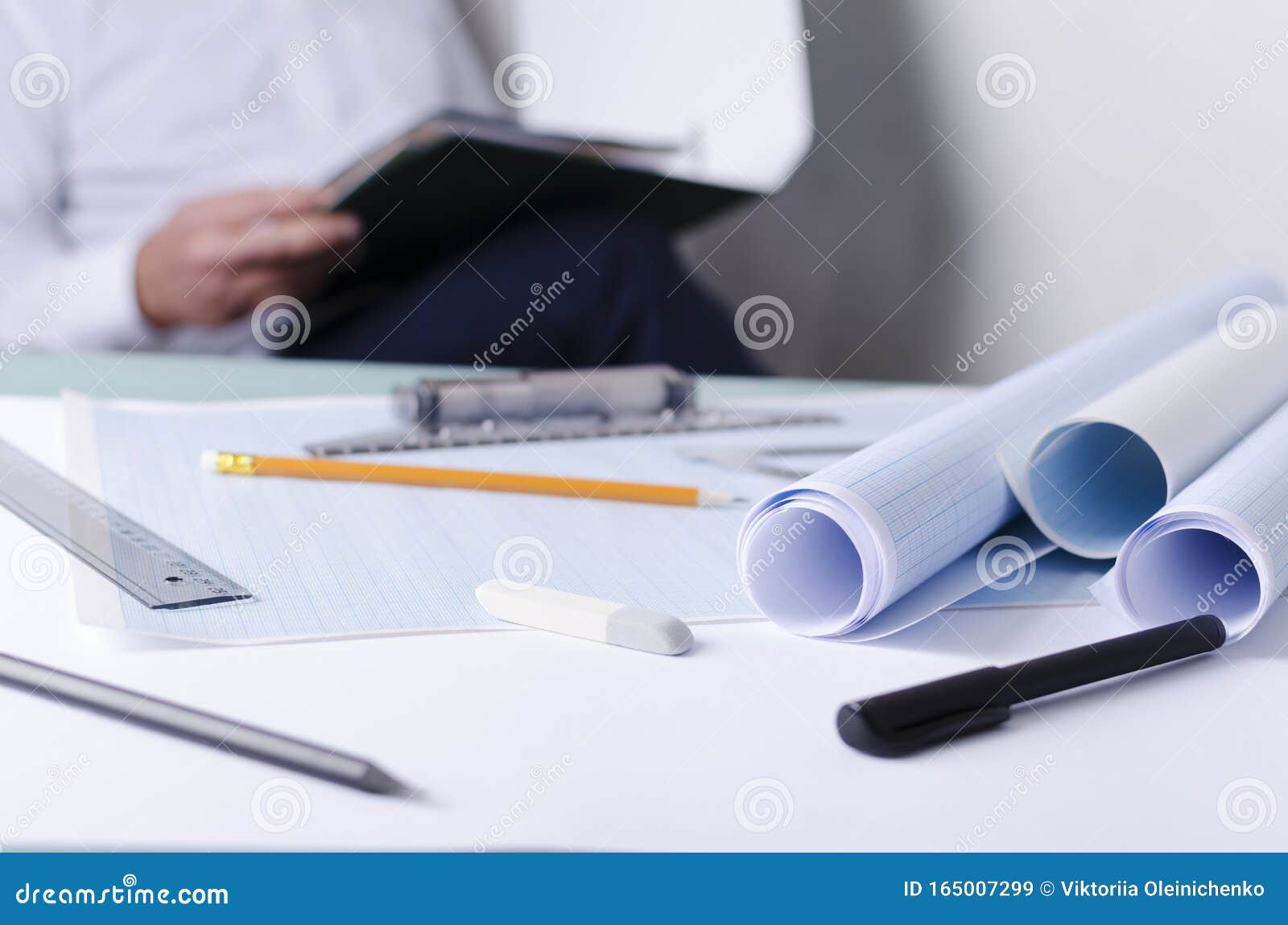 Draftsman at Work, Analyzing Documents for Drafting. Closeup of Graph ...