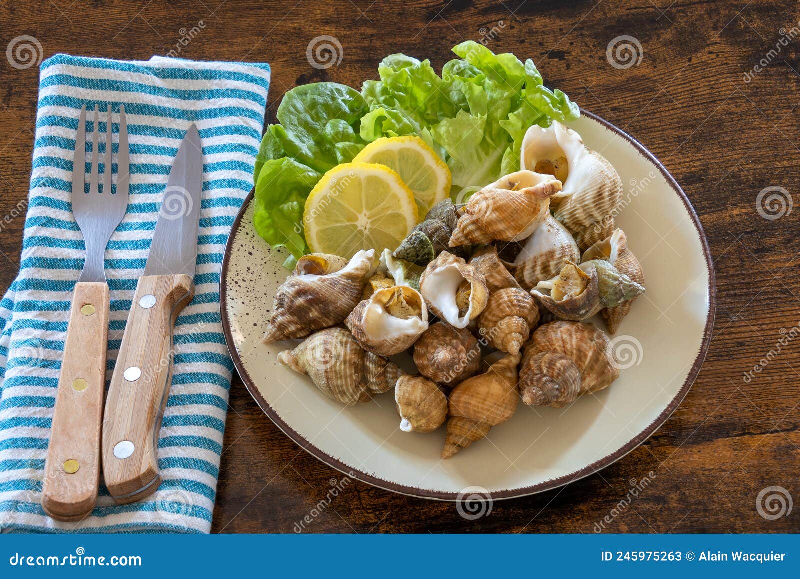 Of Cooked Whelks on a Plate with Salad and Lemon Stock Image - Image of ...