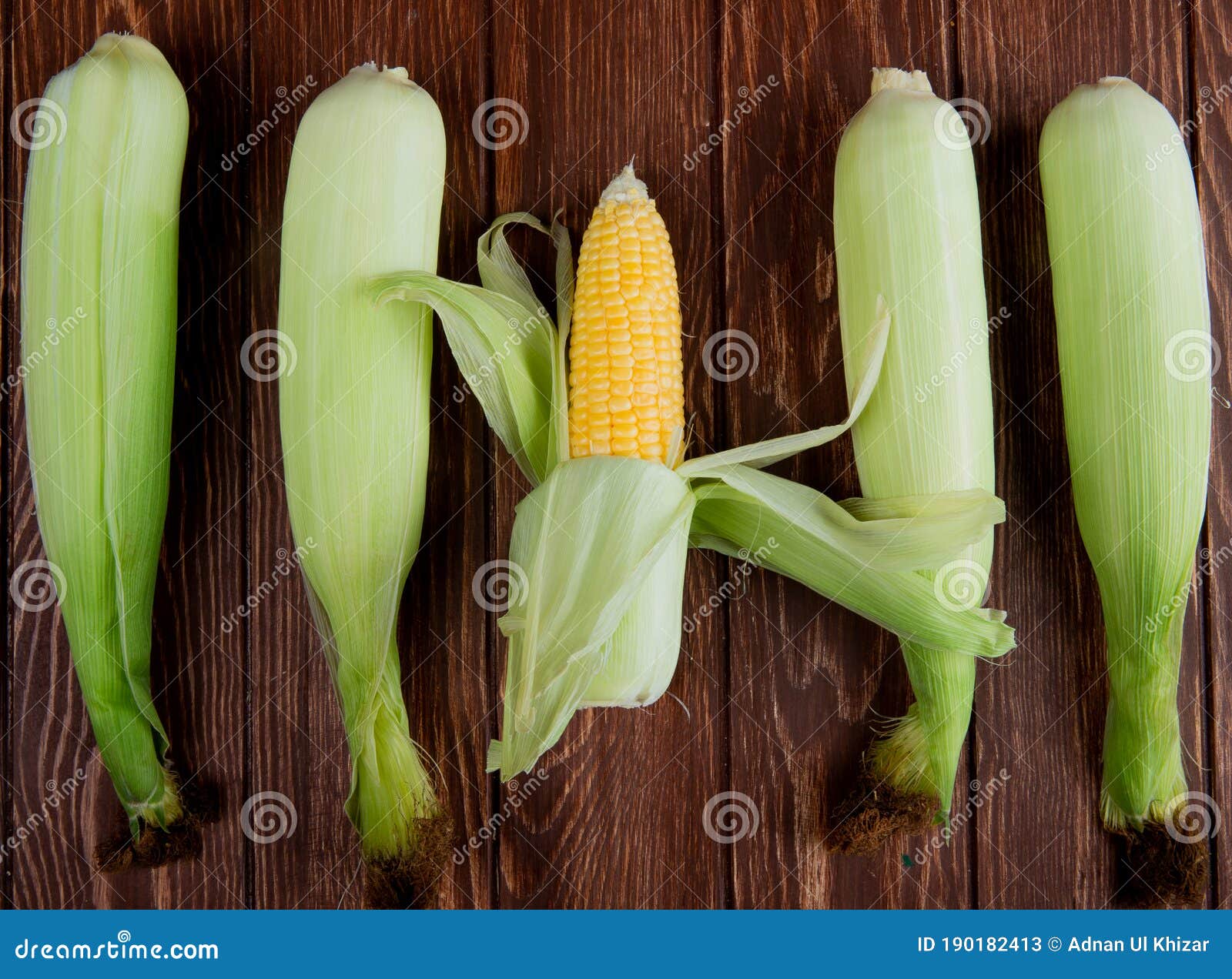 Top View of Corn Cobs with Shell on Wooden Background Stock Image ...