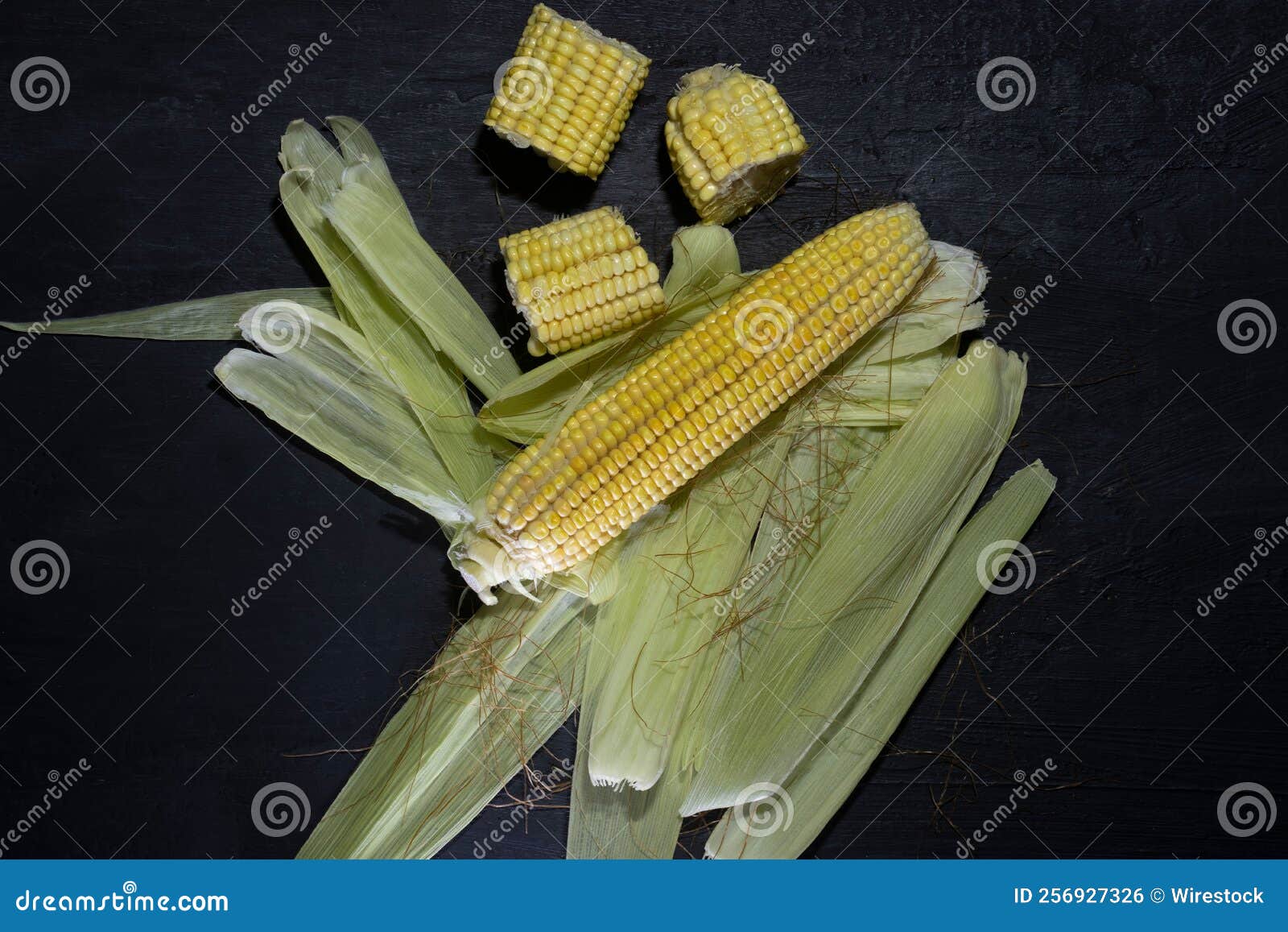 Top View of Corn in Its Leaves on a Dark Surface Stock Photo - Image of ...