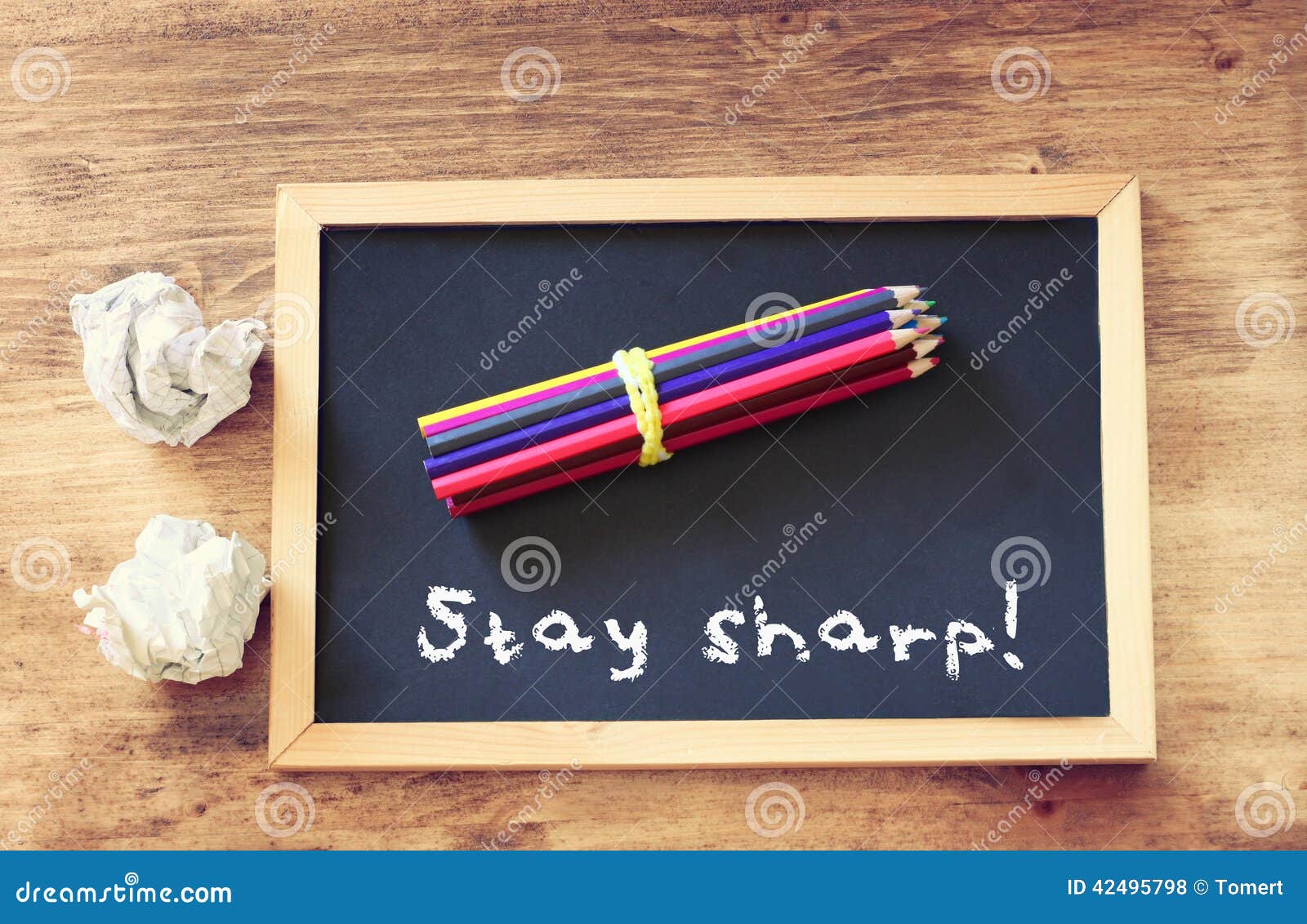 Top View of Crumpled Paper and Pencils Stack Over Blackboard with the ...