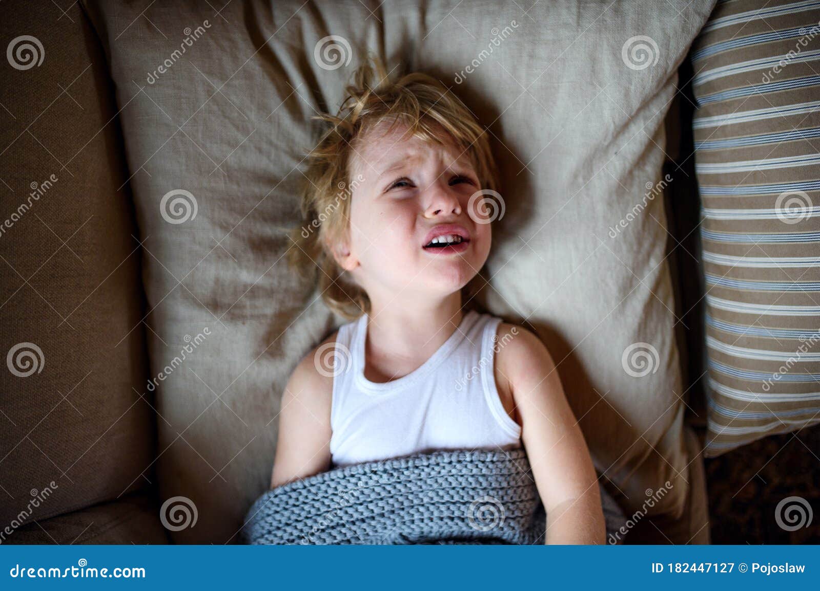 Top View of Crying Small Sick Boy in Bed Indoors at Home. Stock Image ...