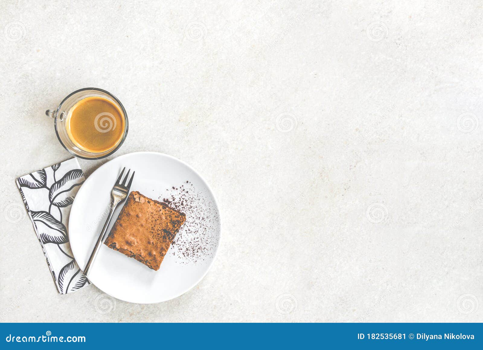 Top View of a Cup of Coffee and a Dessert Plate with Brownie Cake Over ...