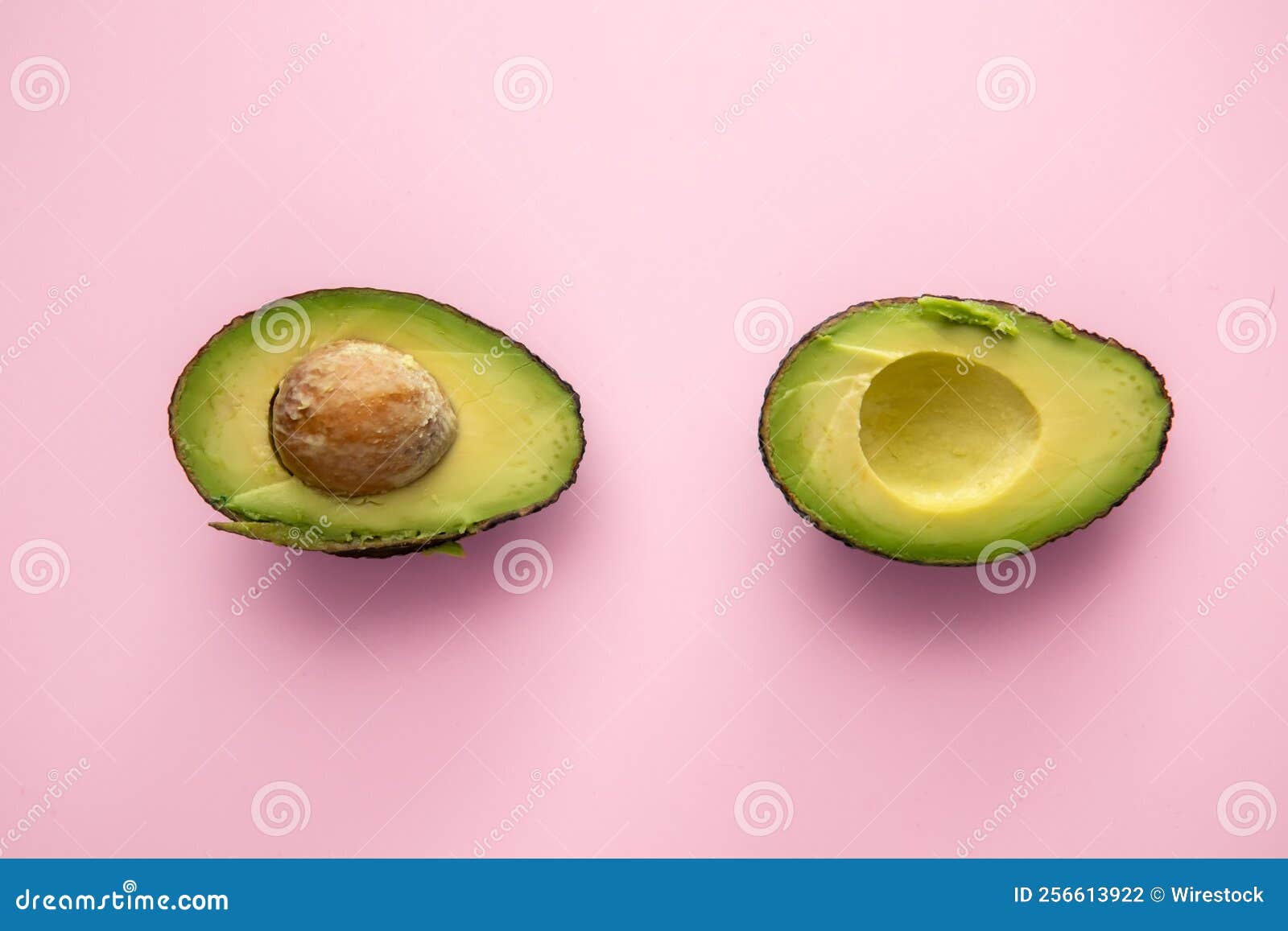 Top View of Cut Out Avocado Pieces on a Pink Surface Stock Photo ...