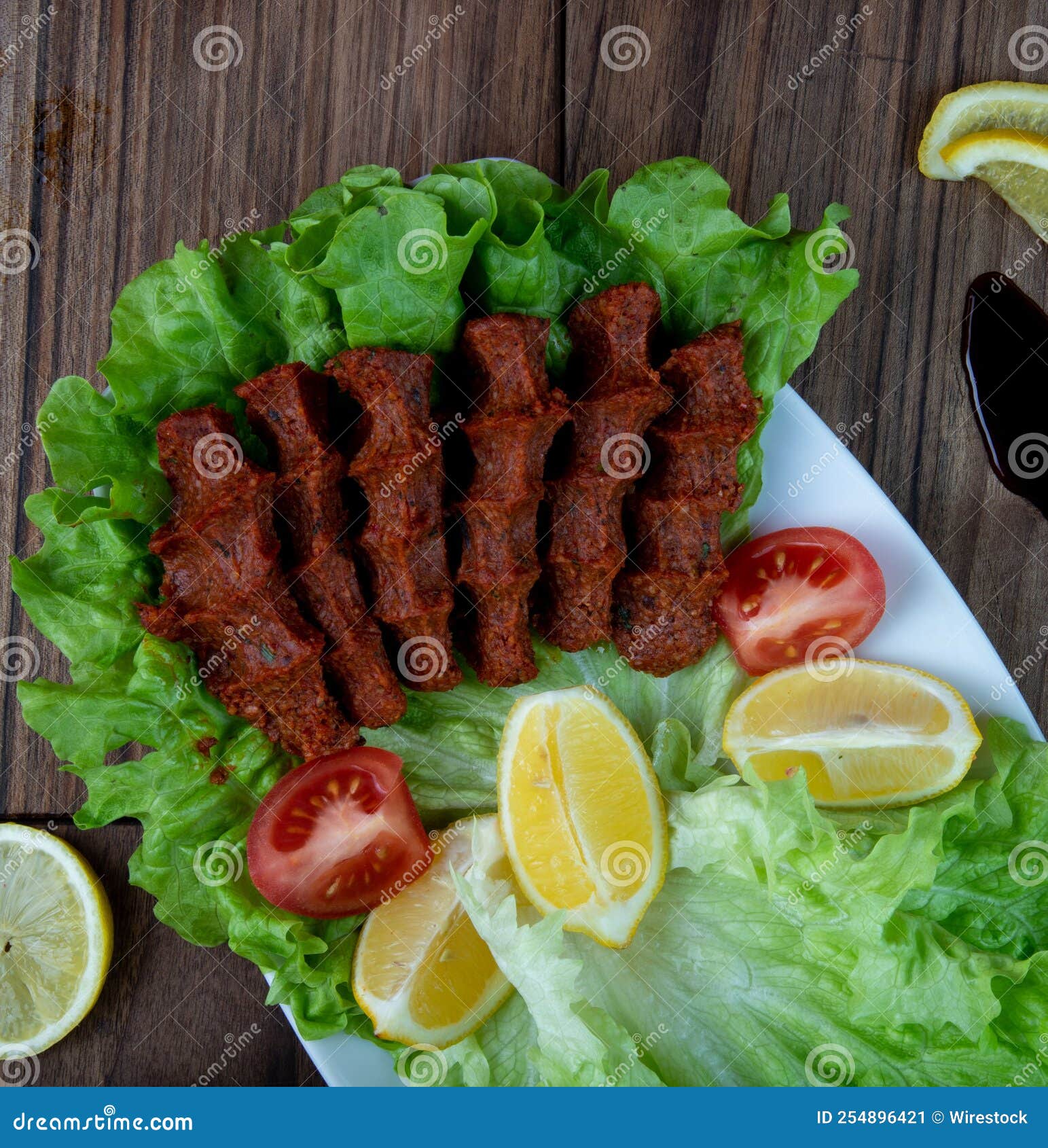 Top View of a Delicious Turkish Chee Kofta Dish with Lettuce, Tomato ...