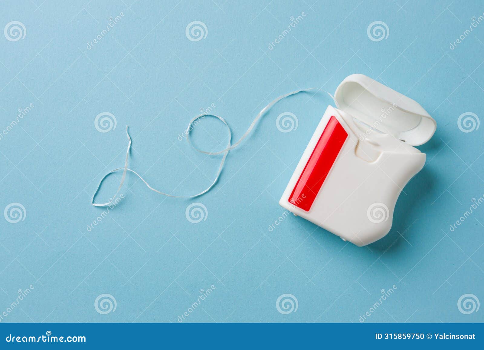 Top View of Dental Floss in White Box on Blue Background Stock Photo ...