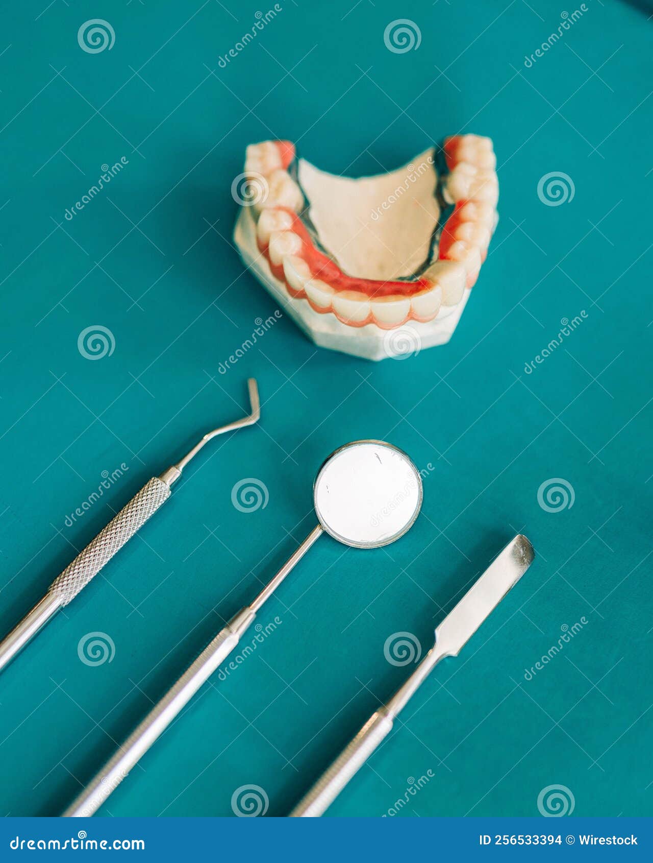 Top View of Dental Tools and Teeth Model on a Turquoise Surface Stock ...