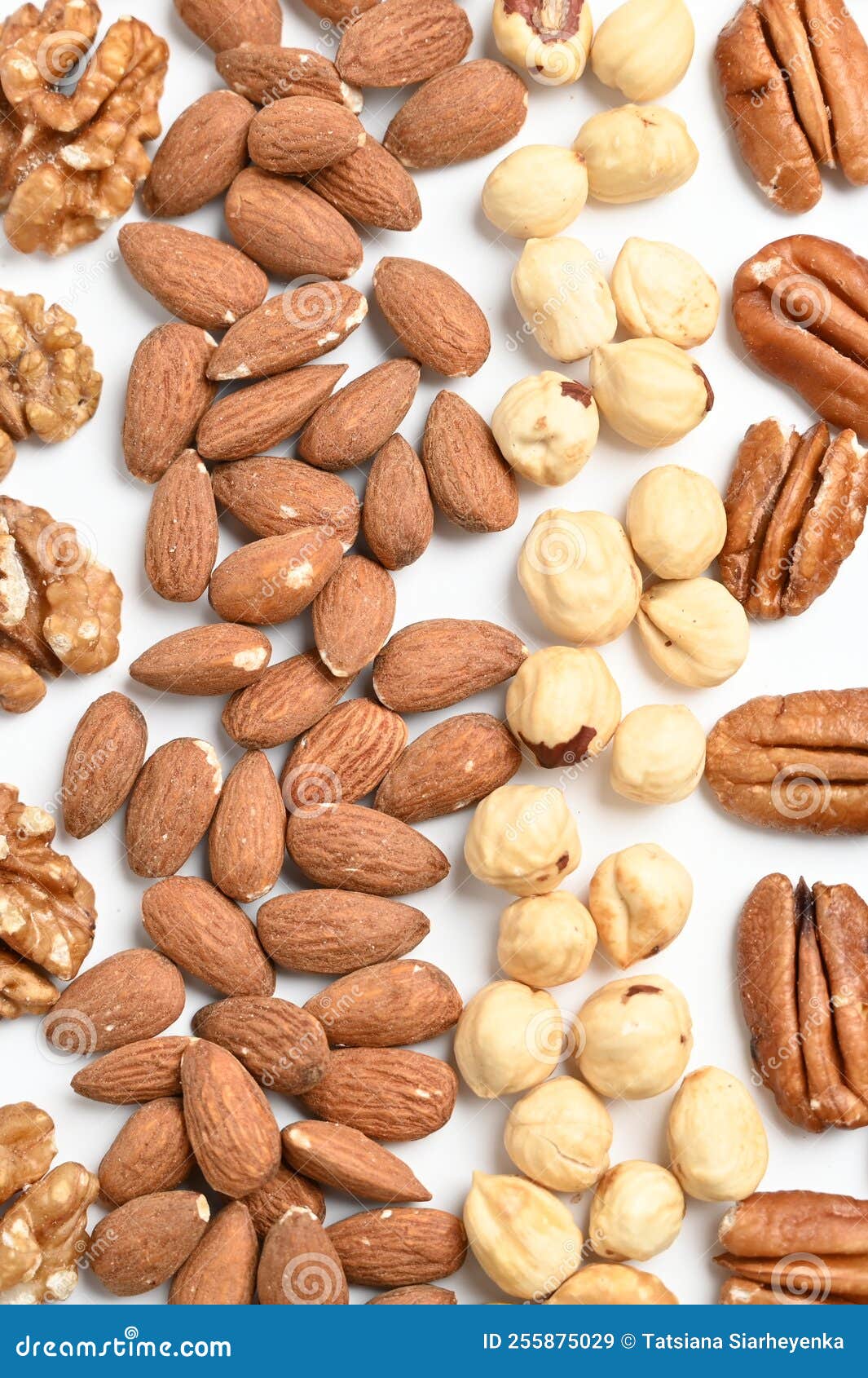 Top View of Different Delicious Nuts on White Background. Space for ...