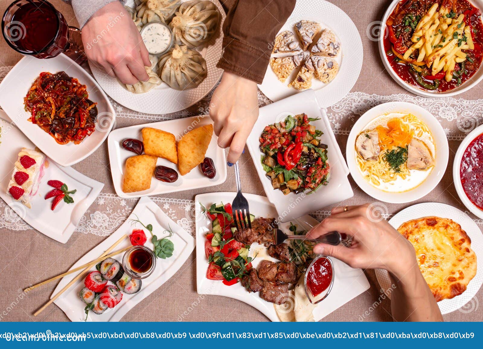 Top View of the Different Dishes on the Table. Hands Reaching for Food ...