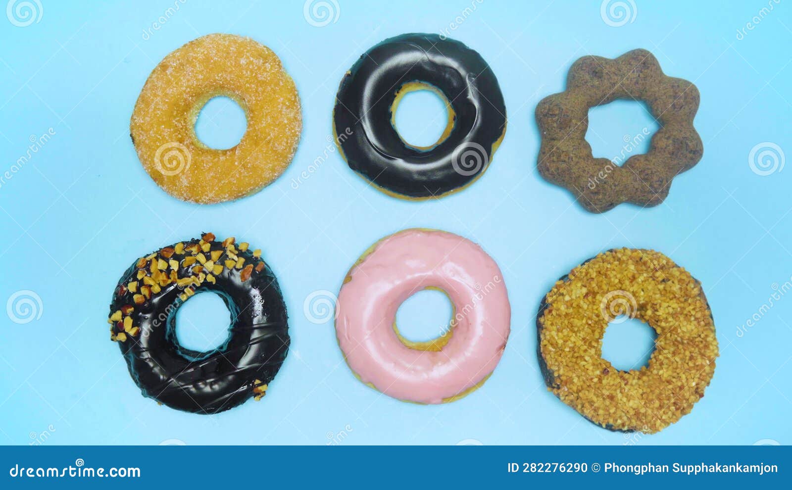 Top View Different Donuts Colors Changing at Blue Background. Stop ...