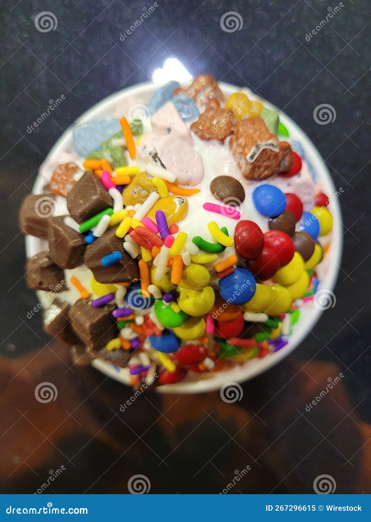 Top View of Different Types of Candies on a White Plate on the Blurred ...