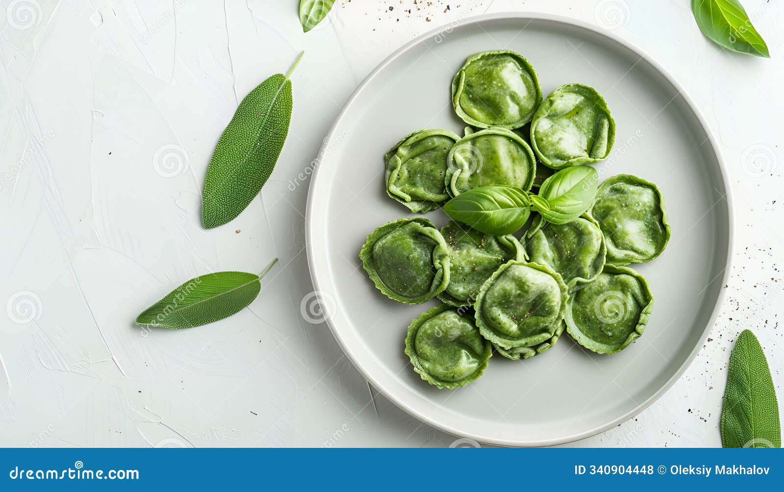 Top View of Dinner Plate with Green Ravioli and Sage on White ...
