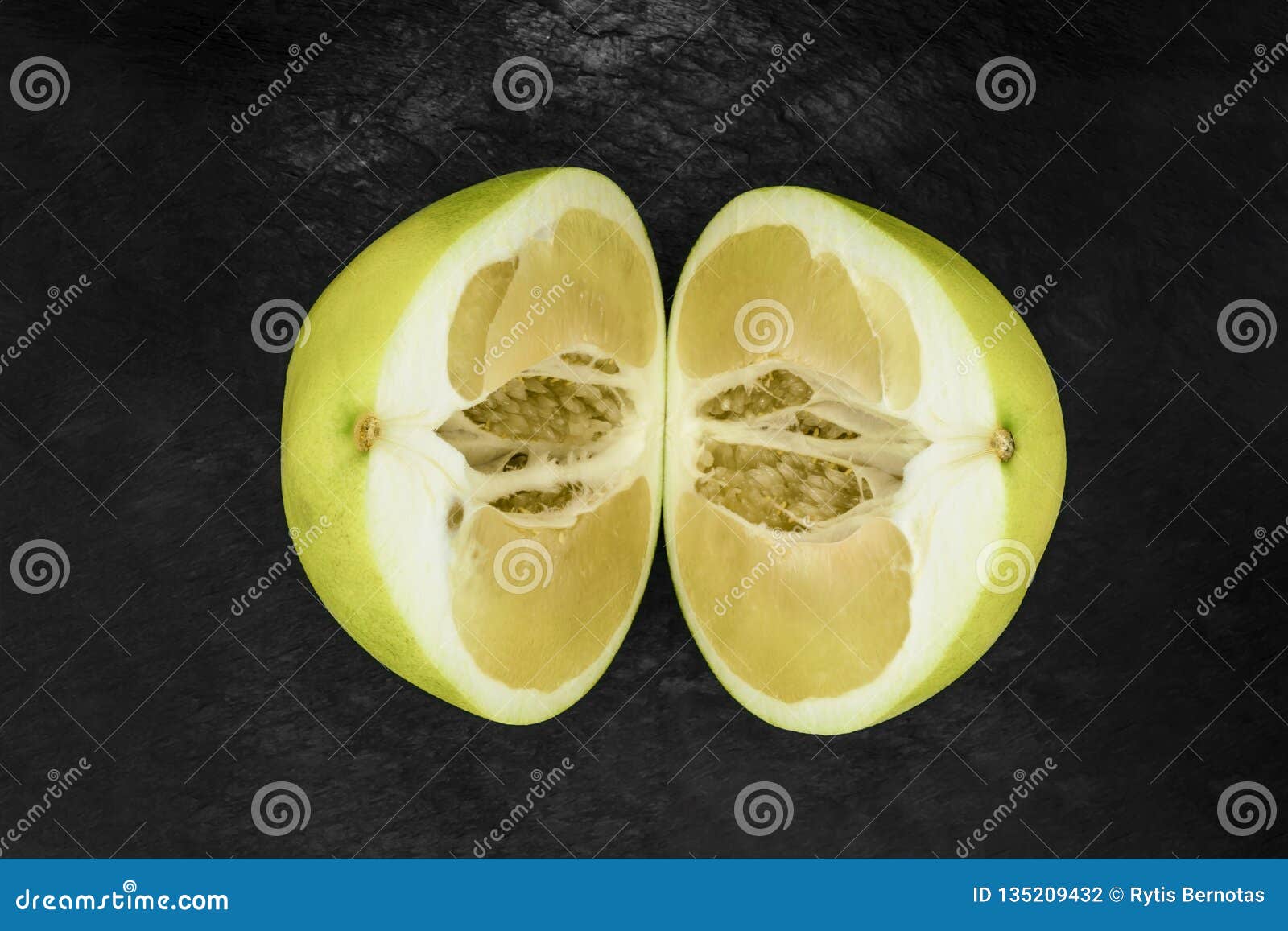 Top View of Divided in the Half Pomelo Fruit and Placed on Black Stone ...