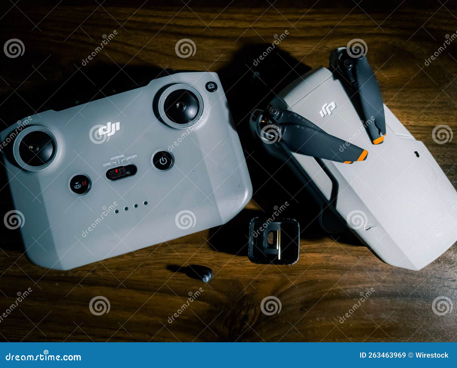 Top View of a DJI Mini 2 Drone and Controller on a Wooden Table ...