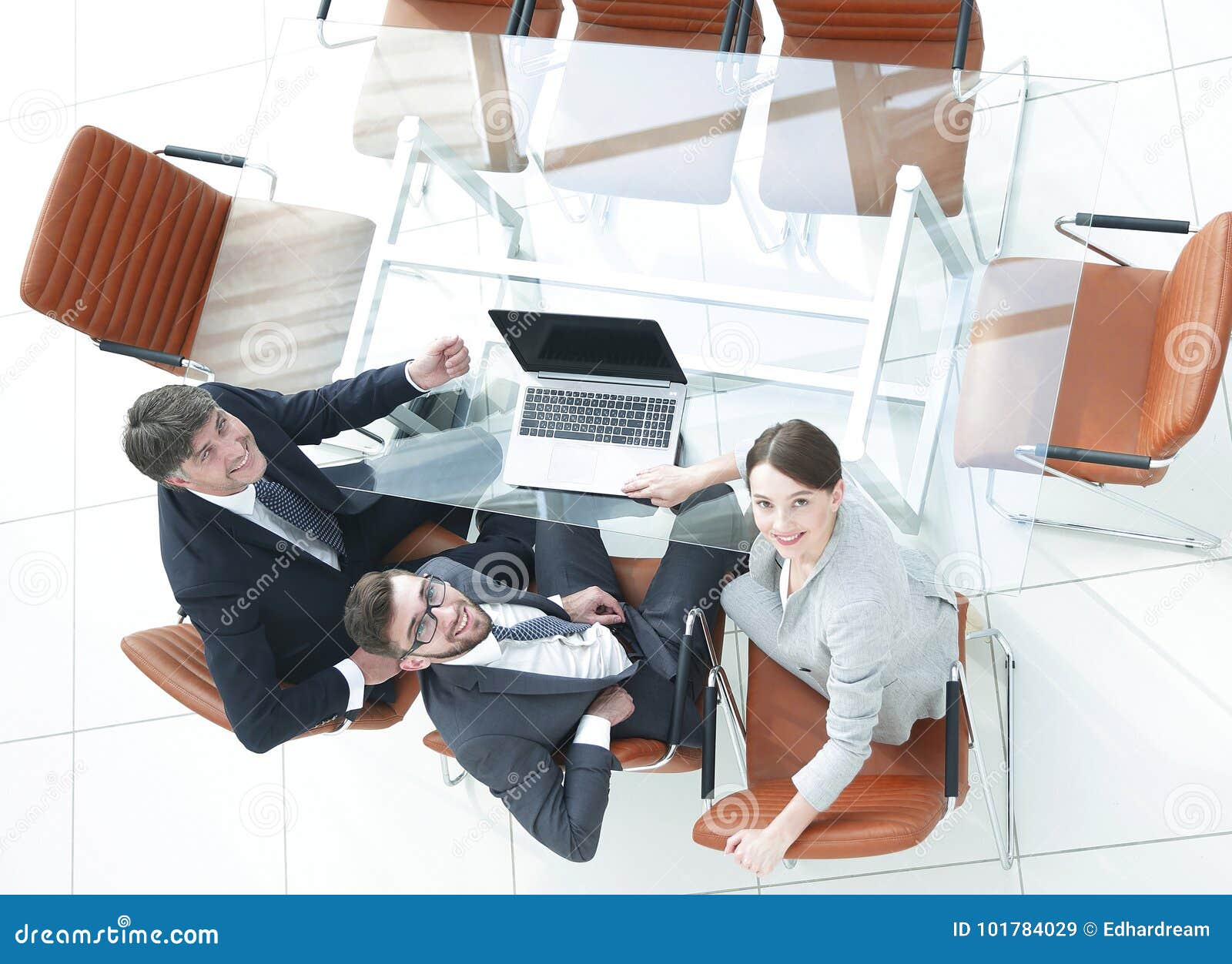 Employees Sitting at the Desk and Looking Up Stock Image - Image of ...