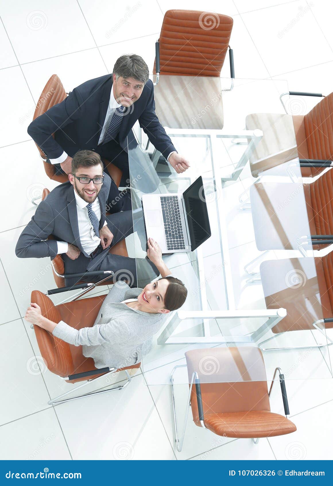 Employees Sitting at the Desk and Looking Up Stock Photo - Image of ...