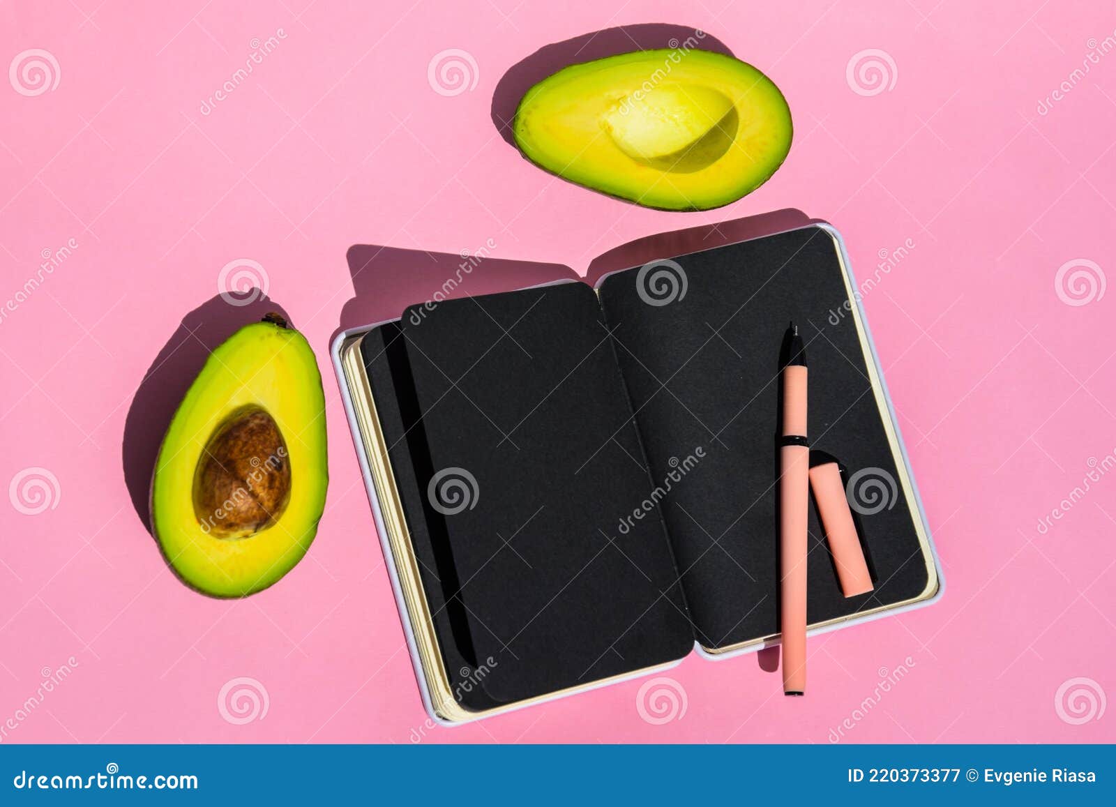 Top View an Empty Notepad and Sliced Avocado on a Pink Background Top ...