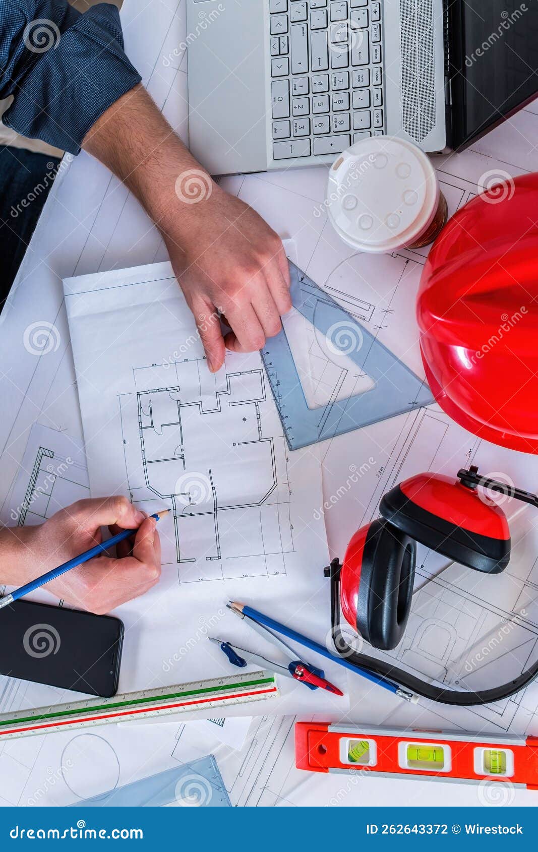 Top View of an Engineer at the Office Desk Designing a Construction ...