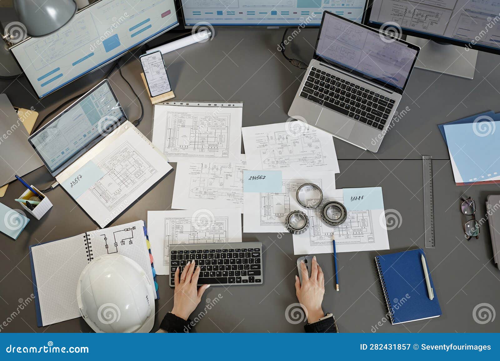 Top View at Engineers Workplace with Blueprints and Plans on Computer ...