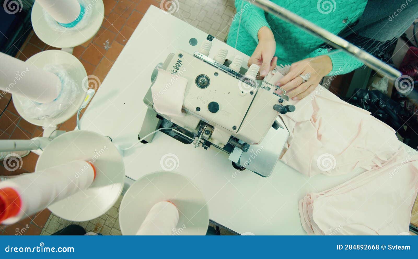 Top View of a Factory Employee Using a Sewing Machine at Work Stock ...