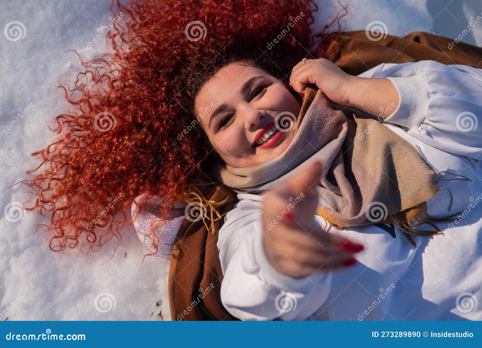 Top View of a Fat Red-haired Woman Lying on the Snow. Stock Photo ...