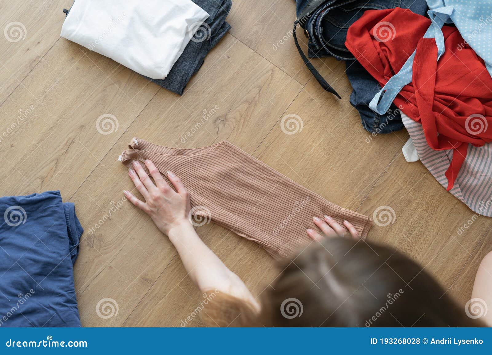 Top View of Female Hands Fold Clothes. the Process of Sorting Things ...