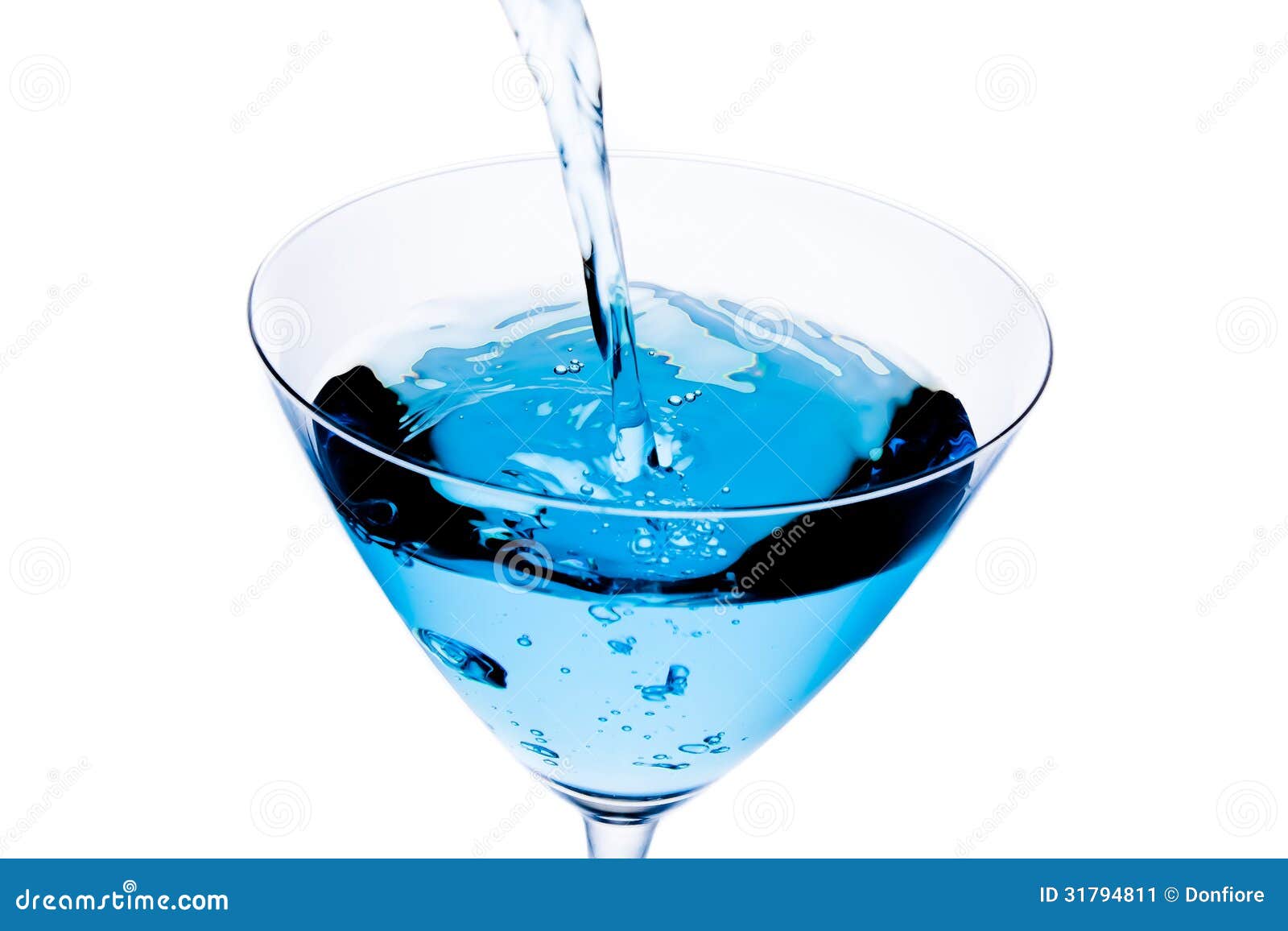 Top of View of Filling a Glass with Blue Cocktail Tilted and Bubbles ...