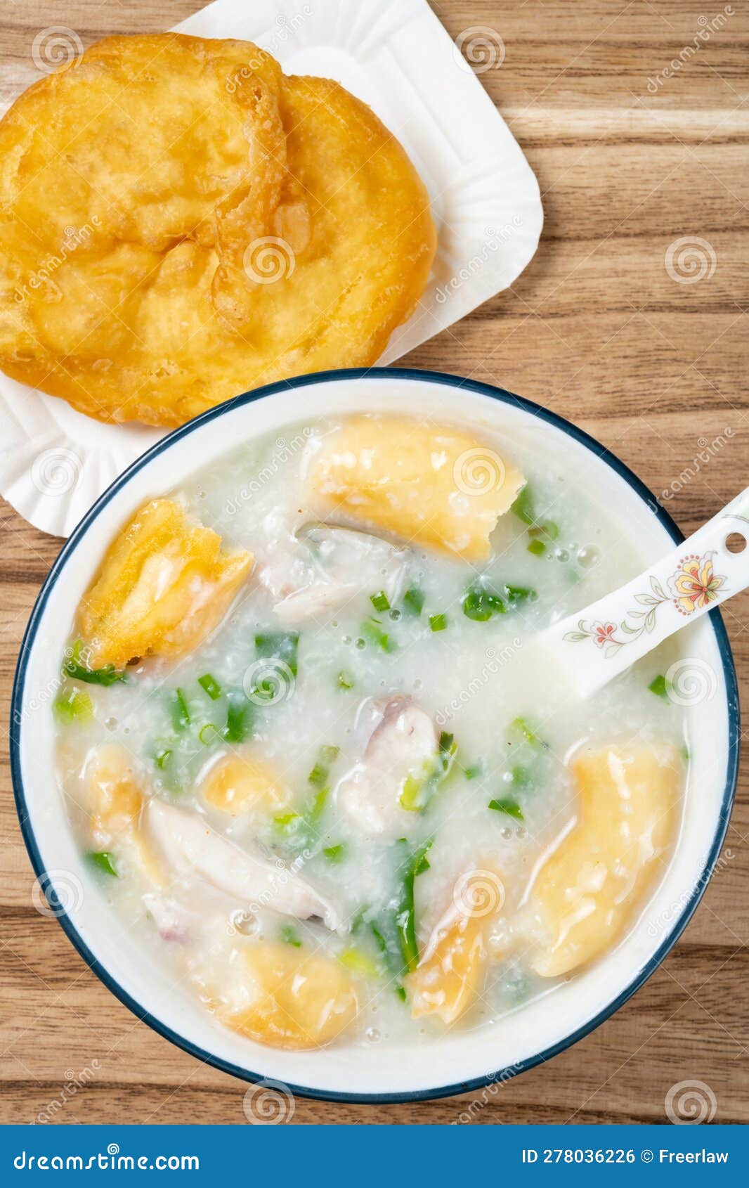 Fish Porridge with Deep-fried Chinese Donuts at Vertical Composition ...