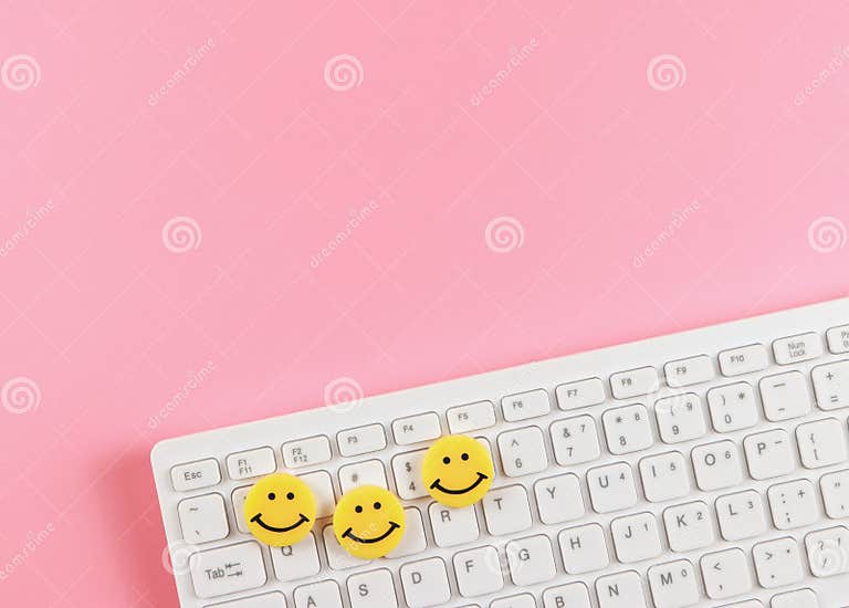 Flat Lay of Threes Yellow Circle Smiling Faces on White Computer ...