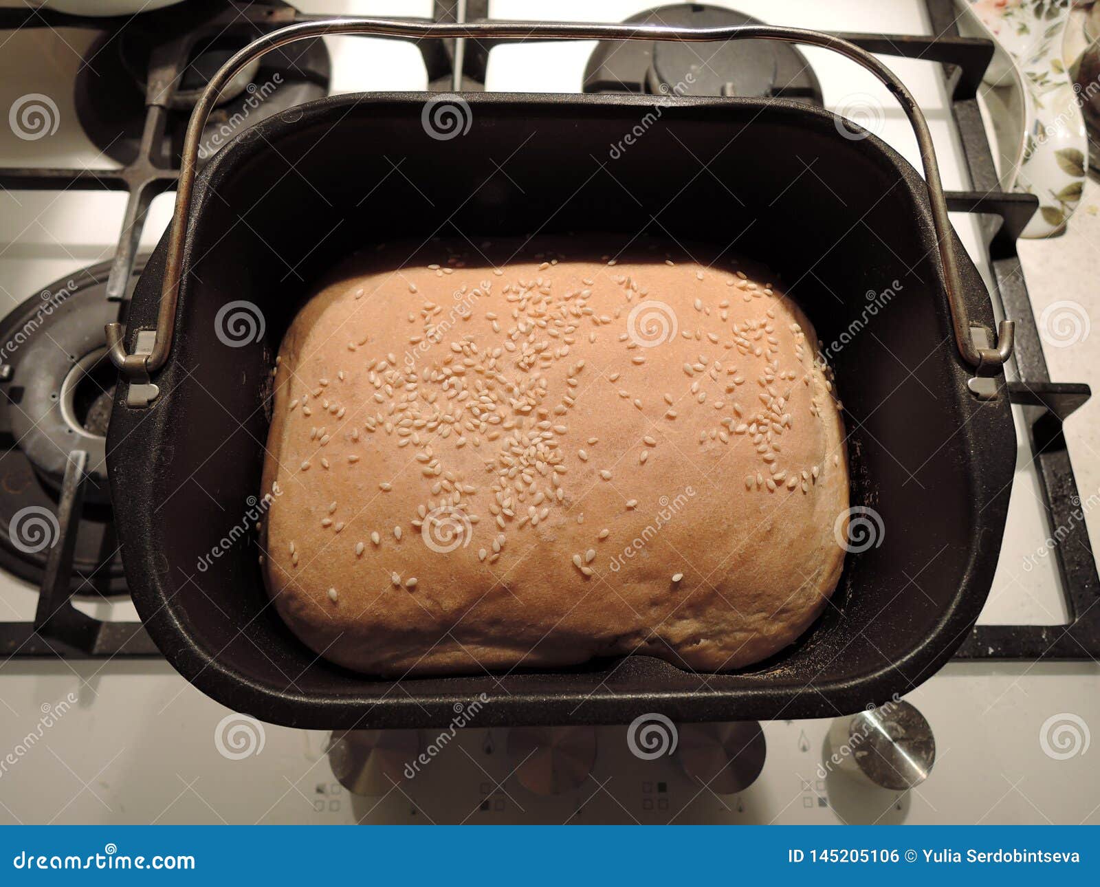 Top View of the Form of a Bread Maker and a Crust of Fresh Baked Bread ...