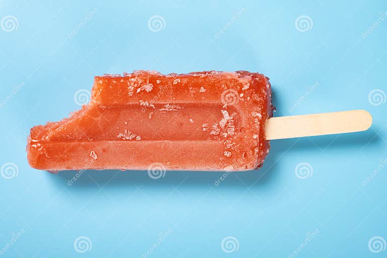 Fresh Red Popsicle with a Bite on a Blue Background Stock Photo - Image ...
