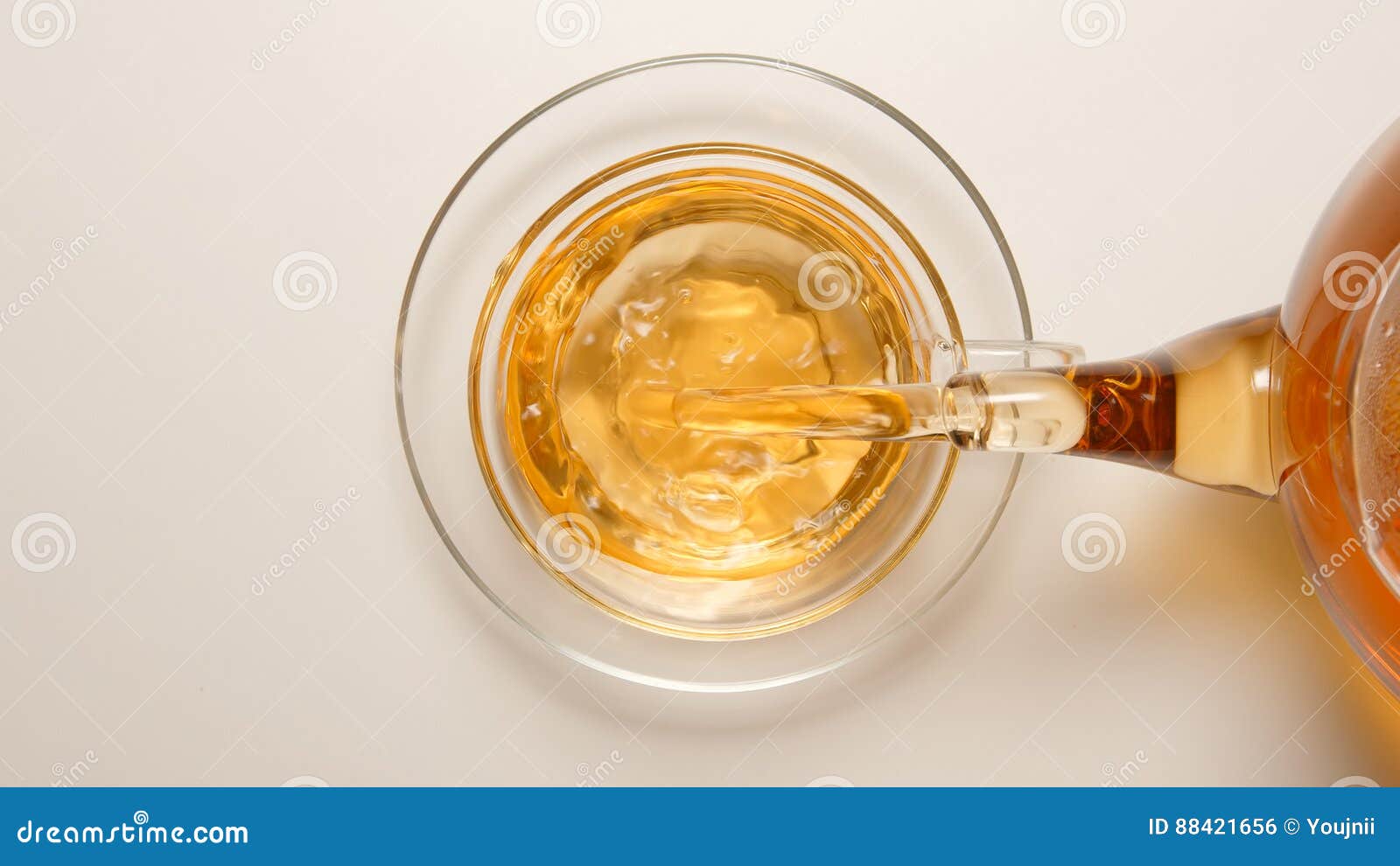 TOP VIEW: Fresh Tea Flowing To a Tea Cup from a Teapot Stock Photo ...