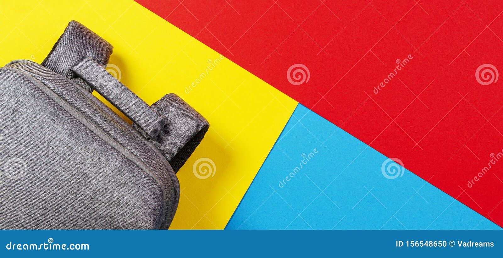 Top View of Gray Backpack on Yellow, Blue and Red Background Stock ...